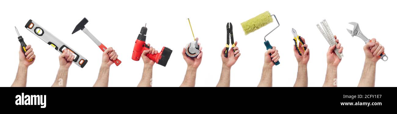 Hands raised holding different tools Stock Photo - Alamy