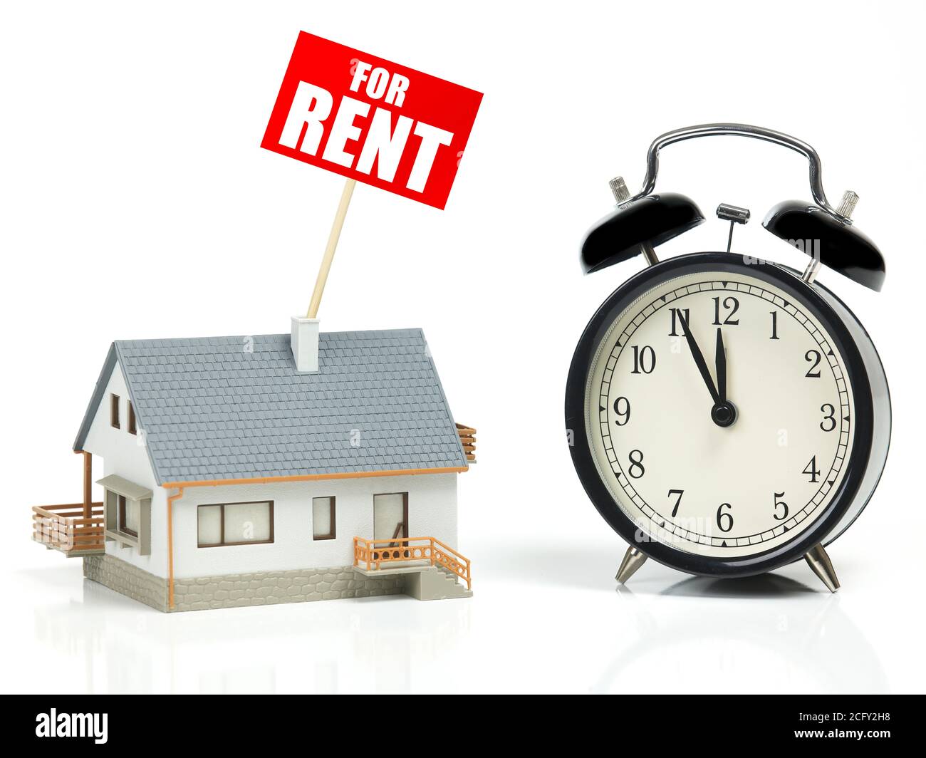 Model house with rent sign and clock on white background Stock Photo ...