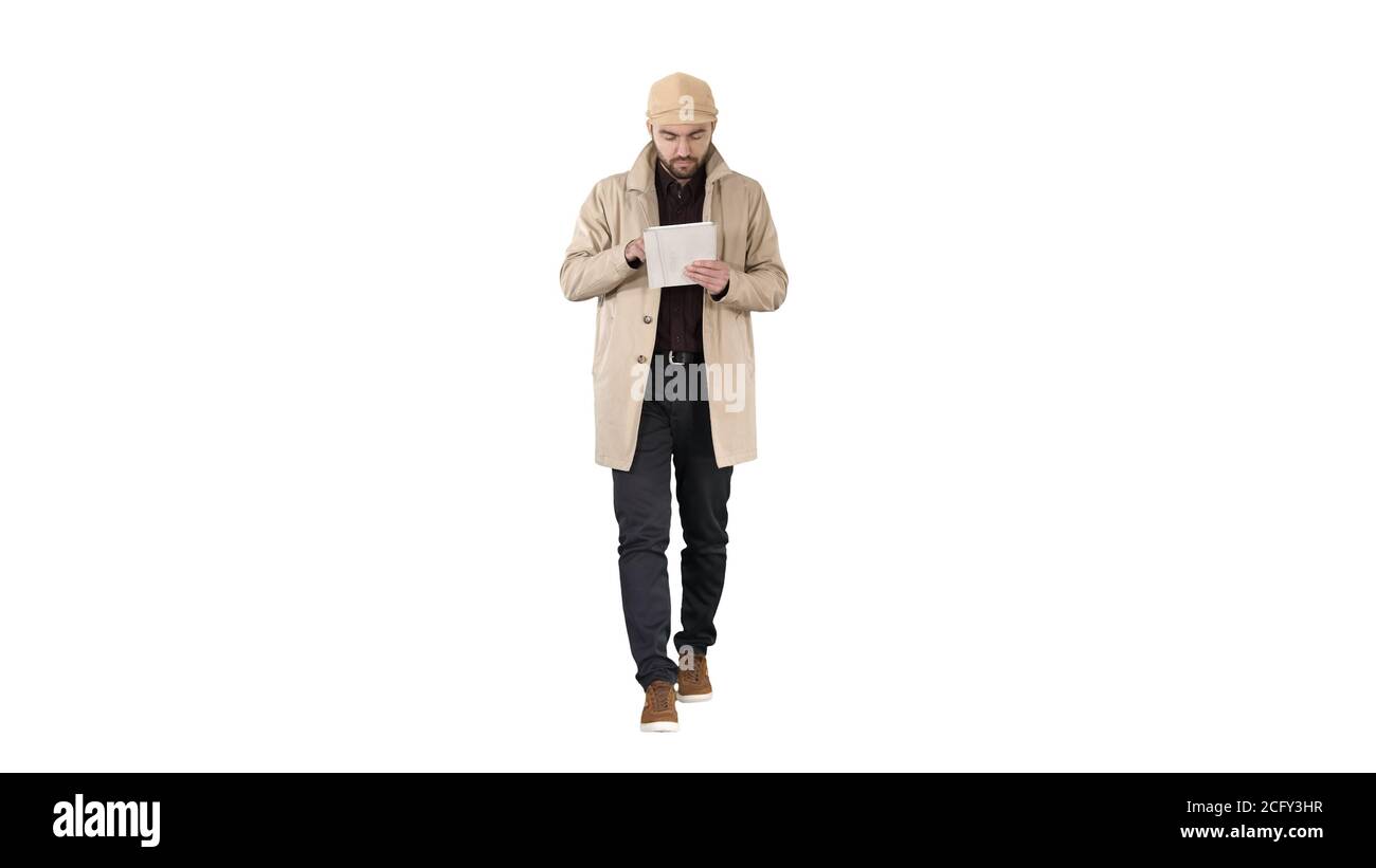 Stylish guy connected on internet with tablet on white background Stock ...