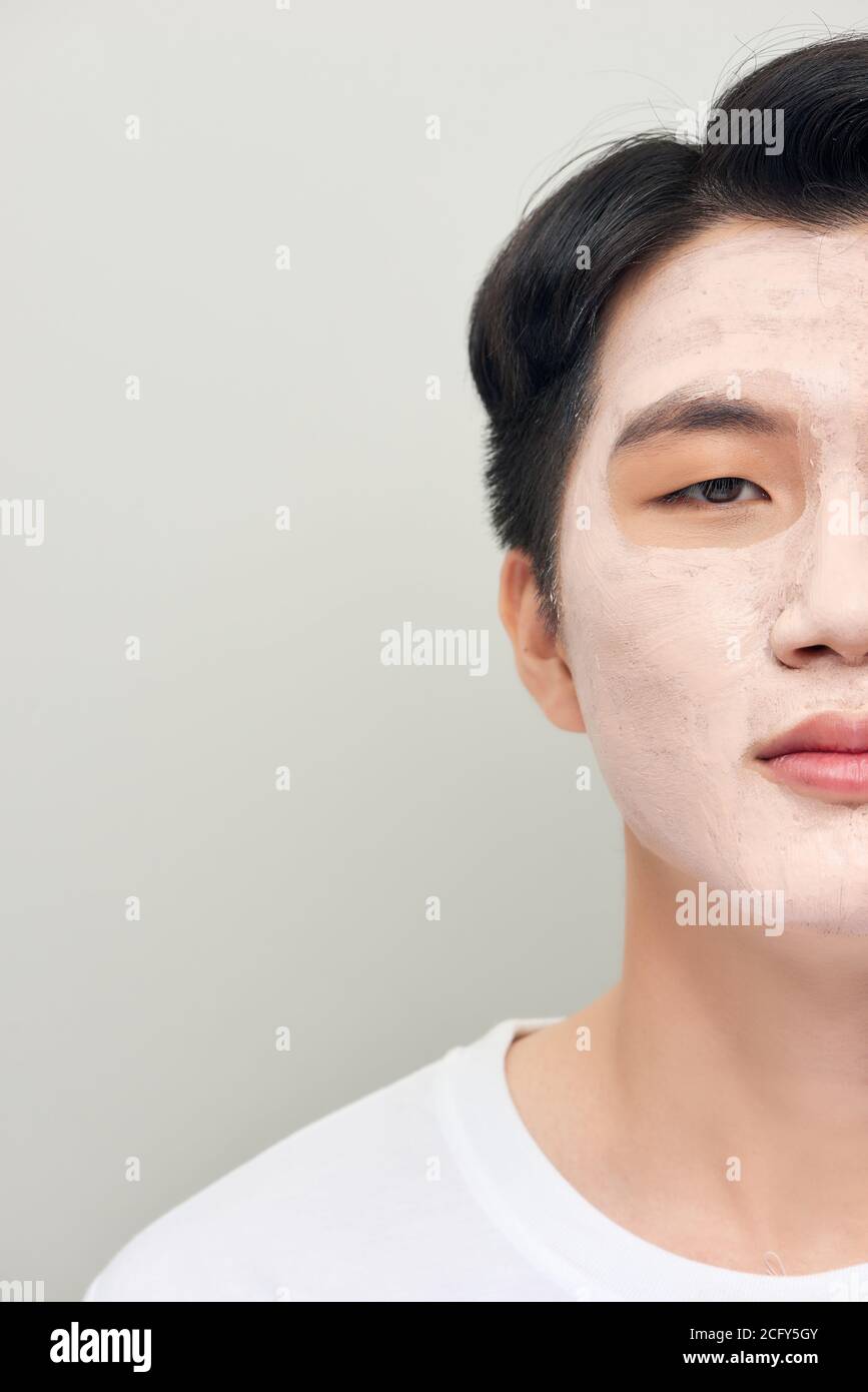 man with a mud mask on his face Stock Photo - Alamy