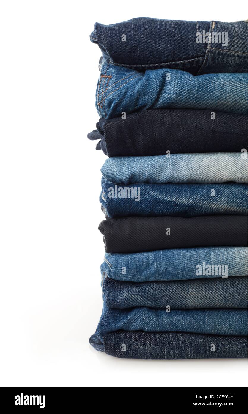 Jeans stack isolated on white Stock Photo - Alamy