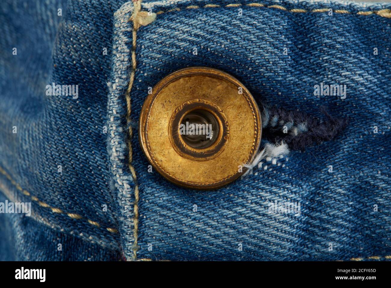 Jeans texture with button Stock Photo - Alamy