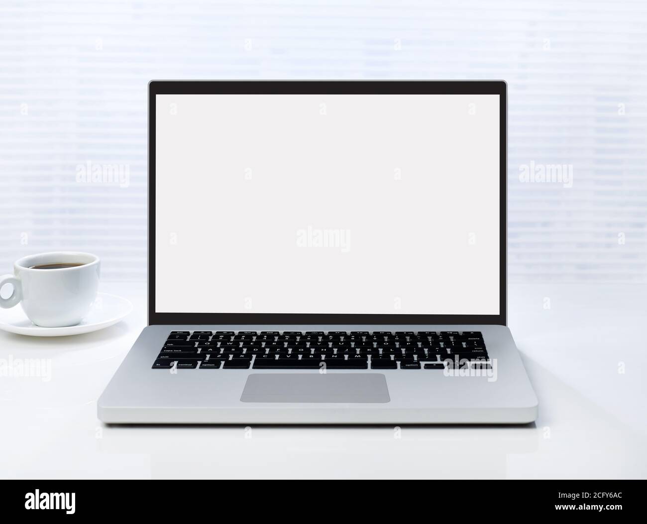 Laptop with blank screen on desk Stock Photo - Alamy