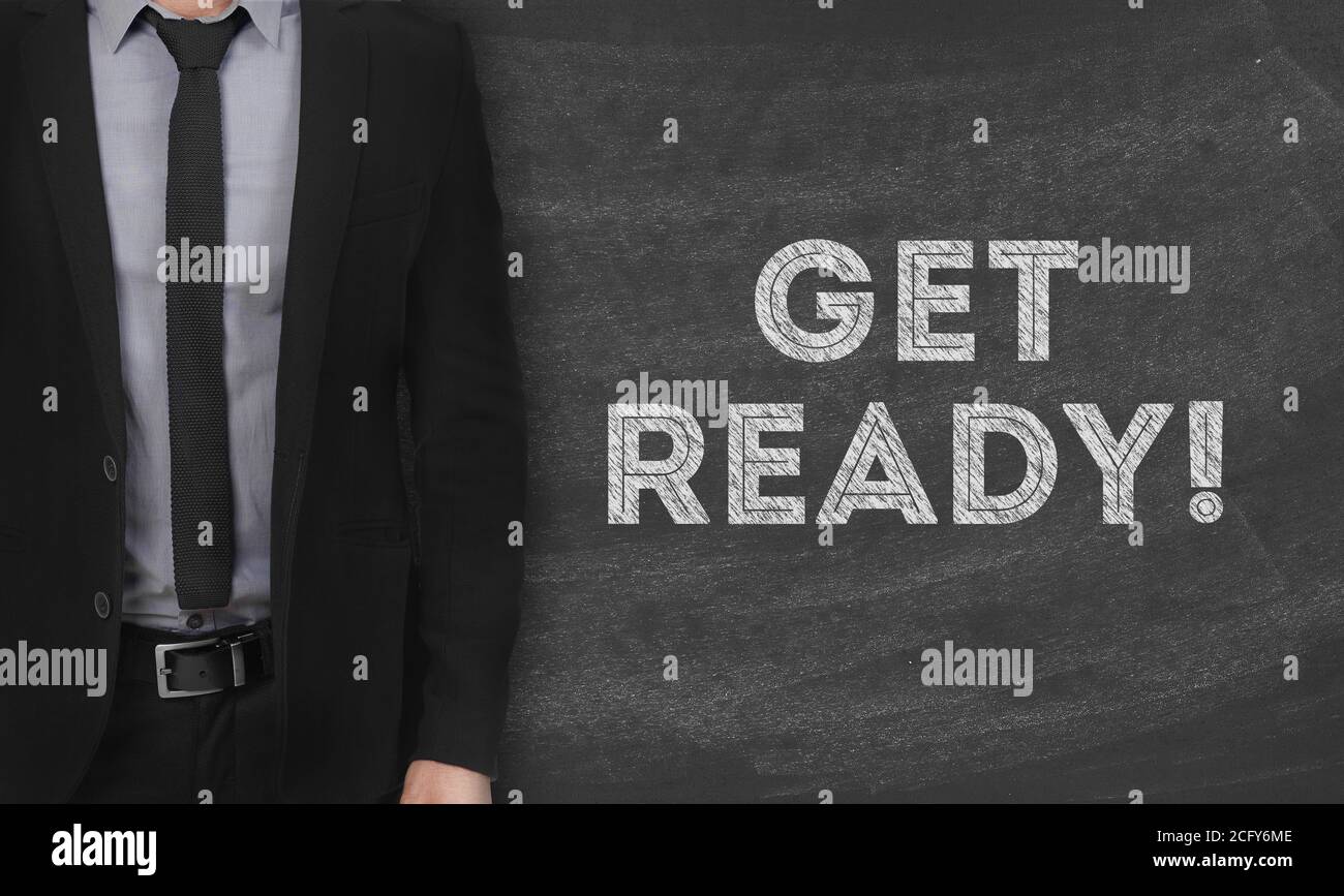 Suit and "get ready" message on blackboard Stock Photo - Alamy
