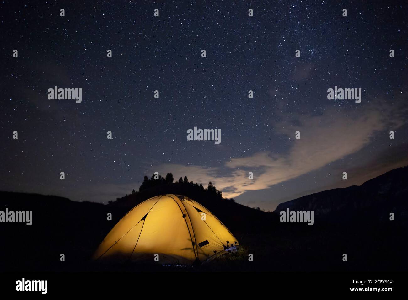 Camping tent glows under a night sky full of stars. Camping, adventure ...