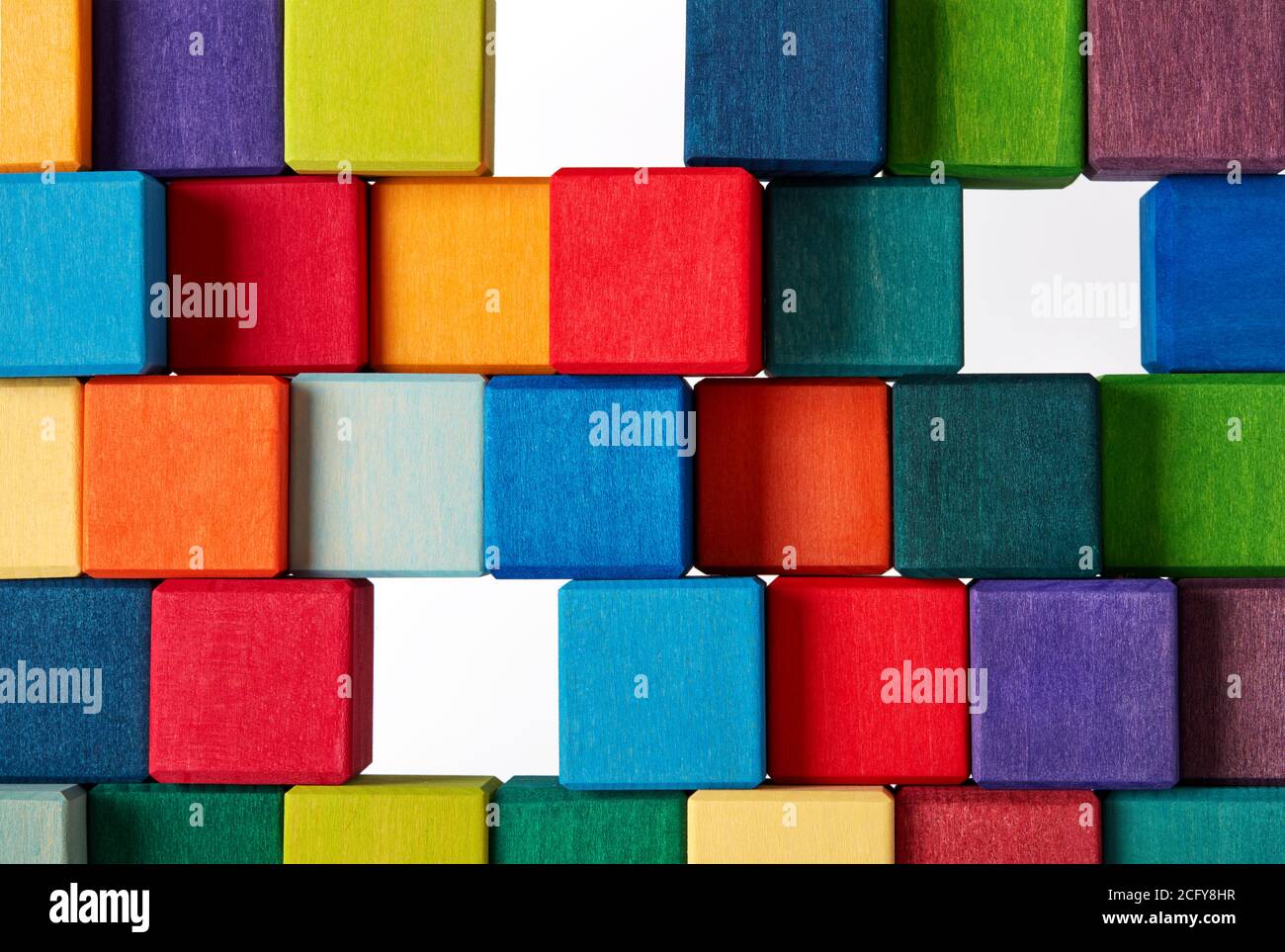 Wooden toy blocks on white background Stock Photo - Alamy