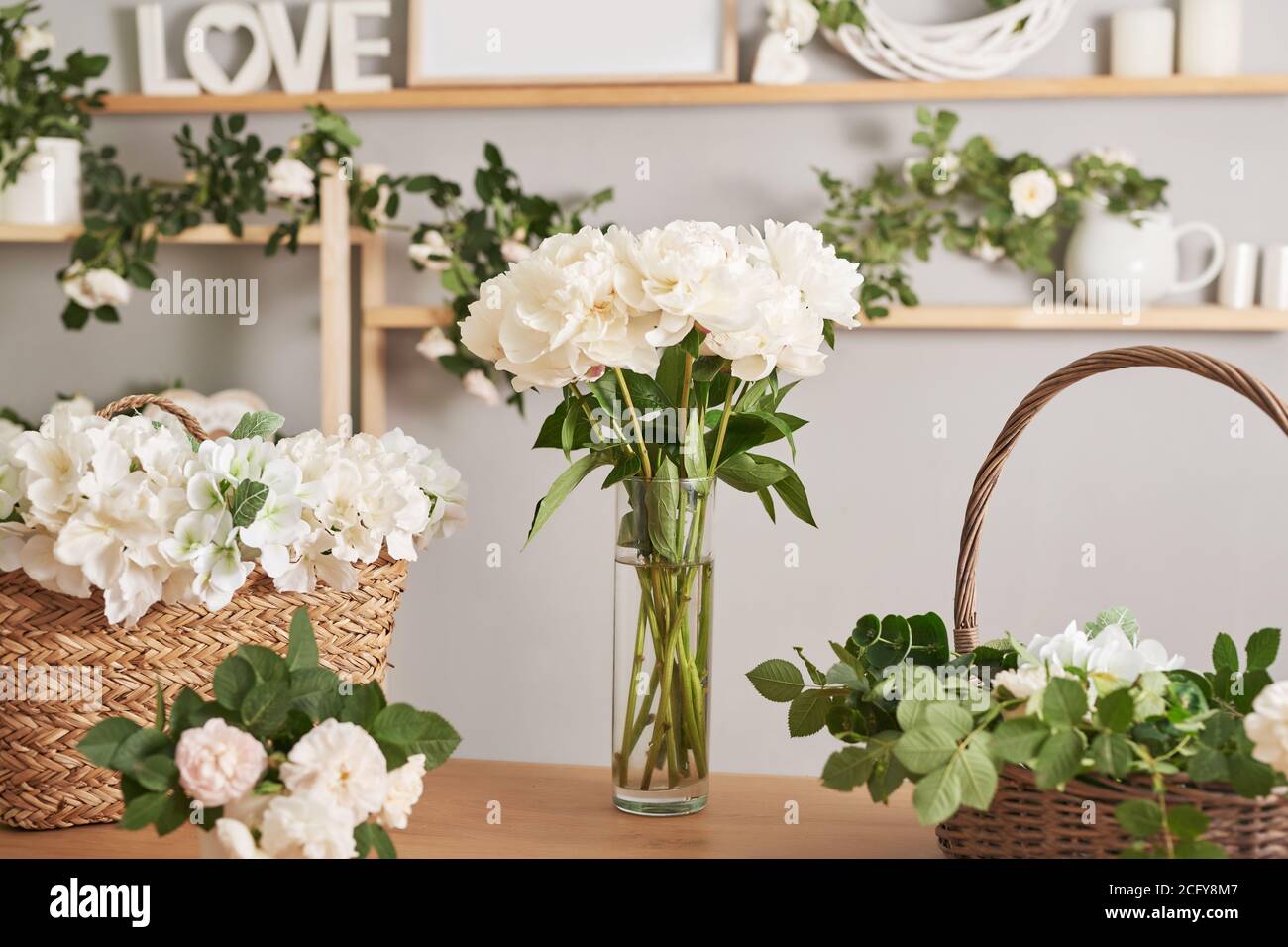 Floral background. Flower shop interior. Floral design studio, making ...