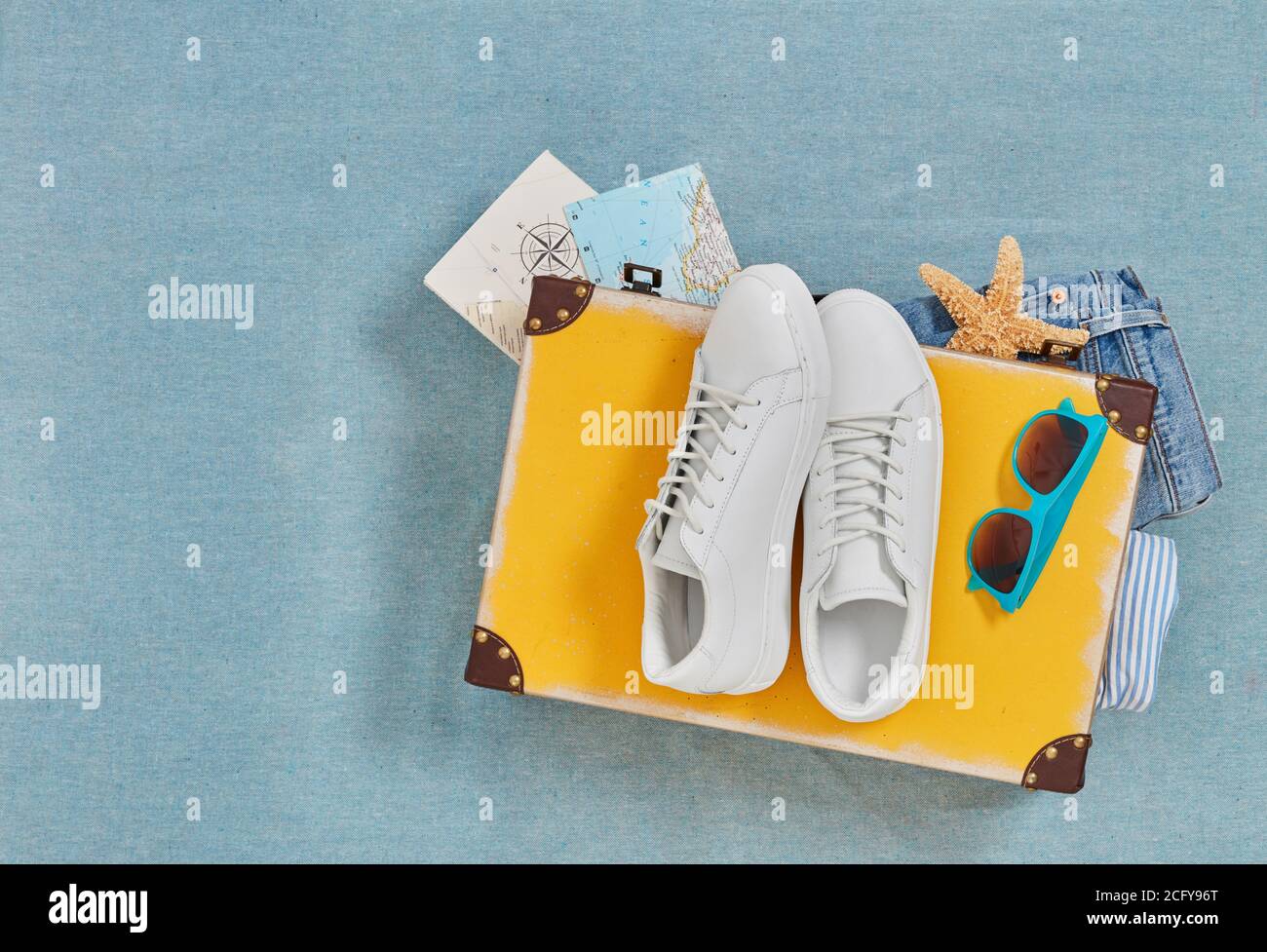 New shoes, luggage with clothing and personal accessories Stock Photo ...