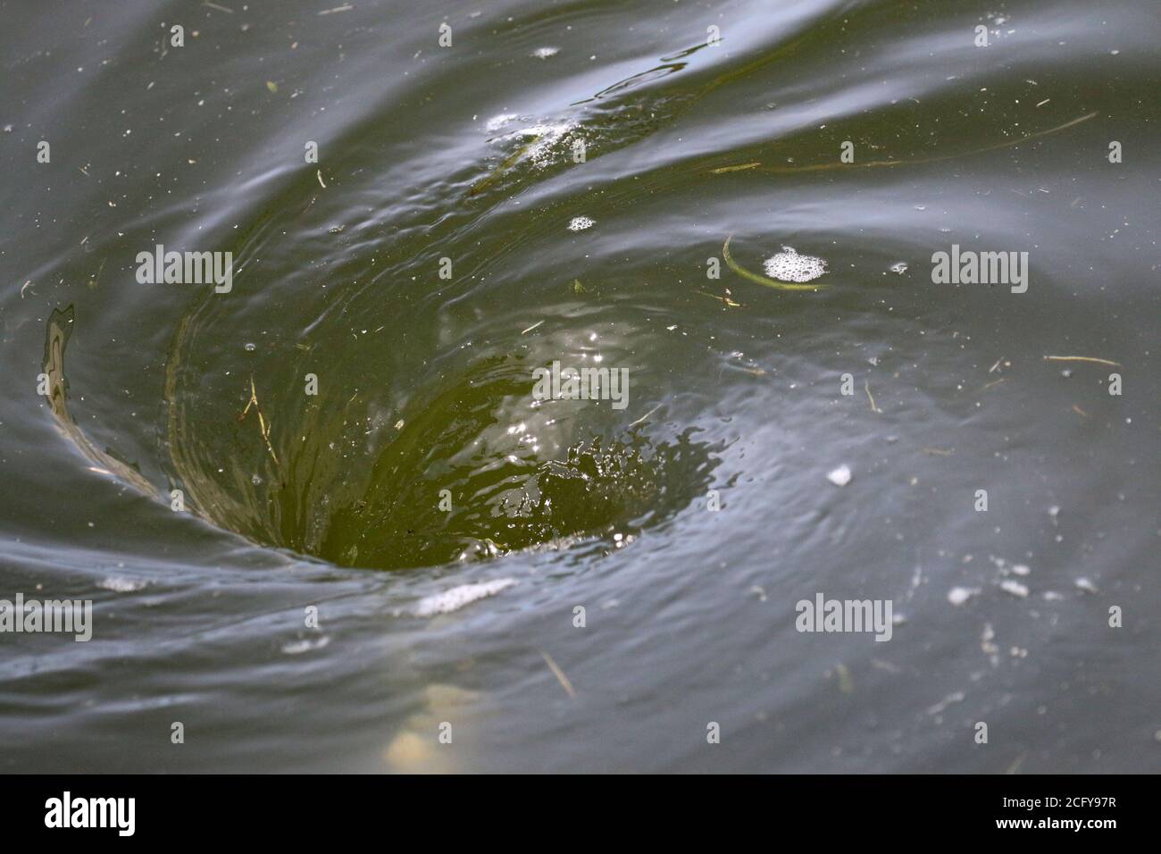 Whirlpools of water near boat lock Stock Photo - Alamy