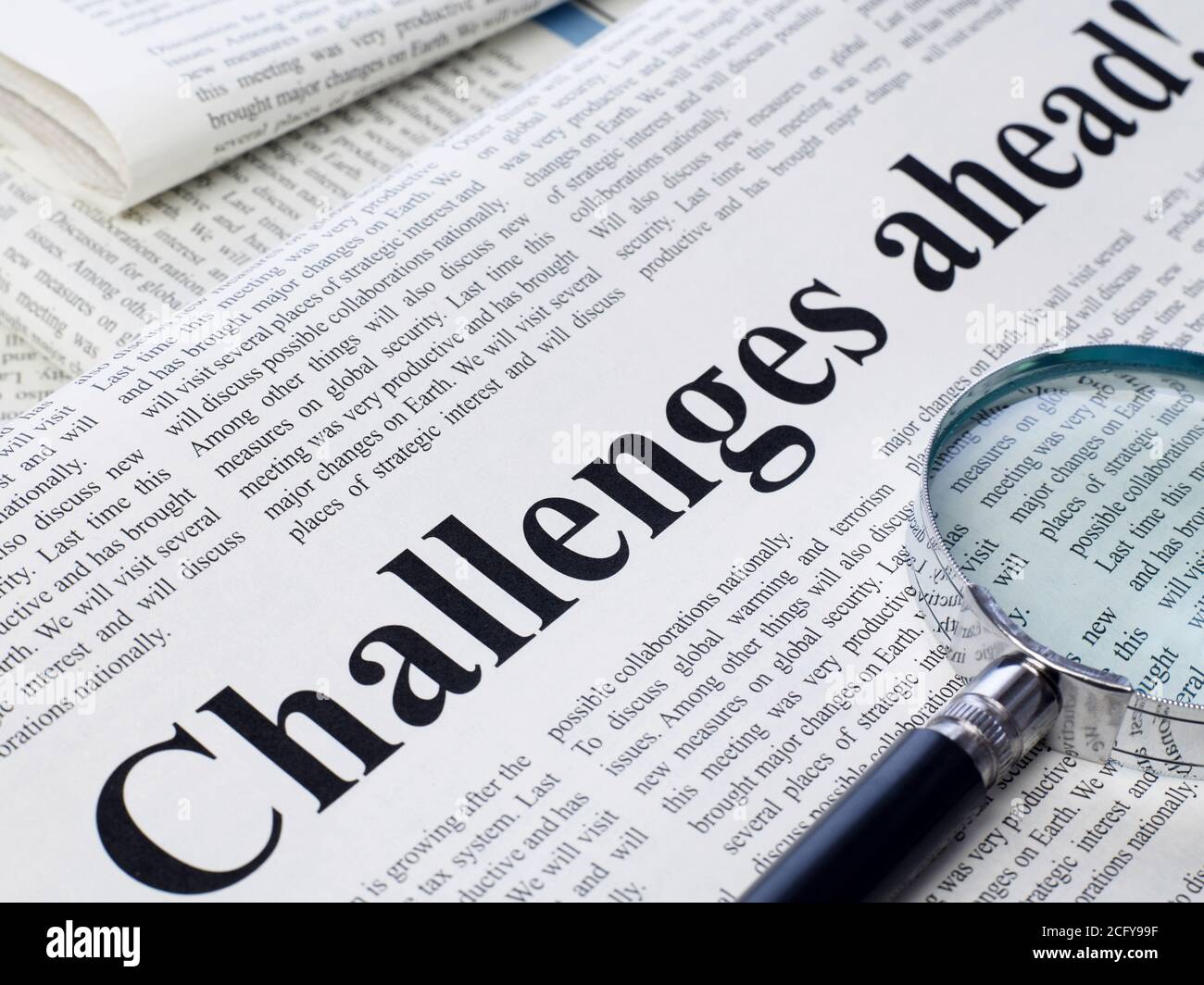 Challenges ahead headline on newspaper Stock Photo - Alamy