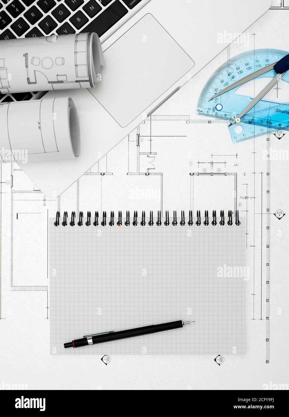Notebook, laptop and blueprints Stock Photo - Alamy