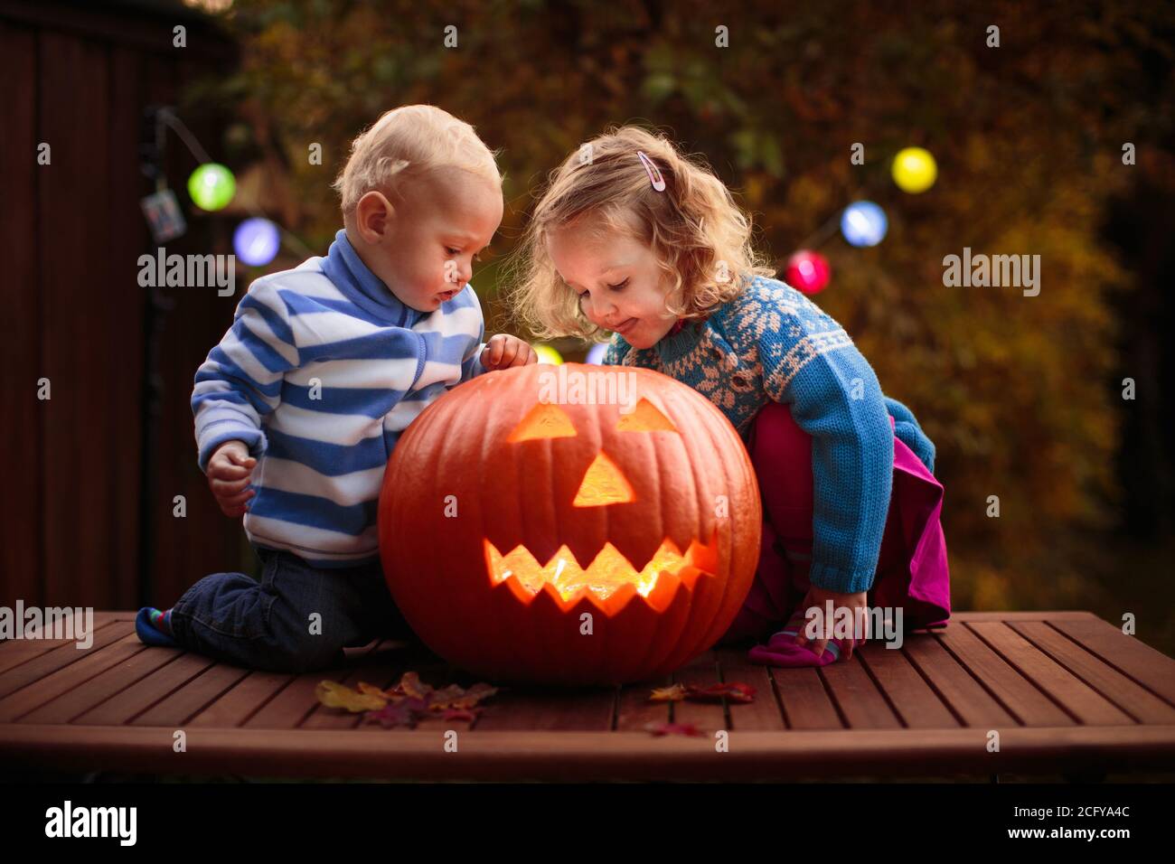Child carving Halloween pumpkin. Kids carve pumpkins for trick or treat ...