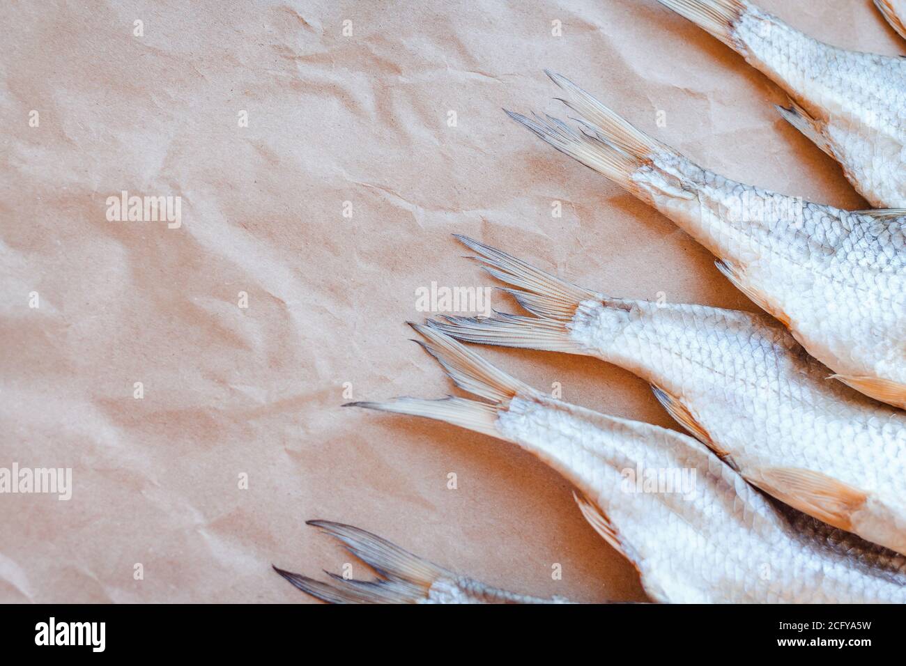 Dried fishes template banner on craft paper background with empty space ...