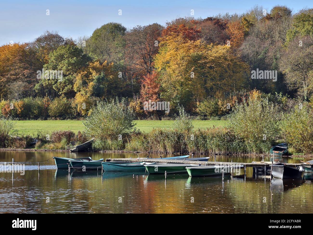 Boats on autumn leaves lake hi-res stock photography and images - Alamy