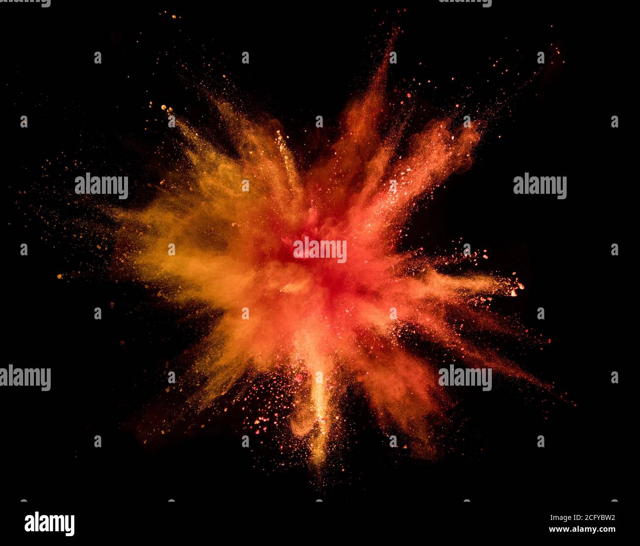 Explosion of coloured powder isolated on black background. Abstract ...
