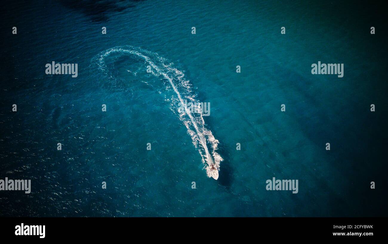 Aerial view of speed boat in motion. Water transportation and summer ...