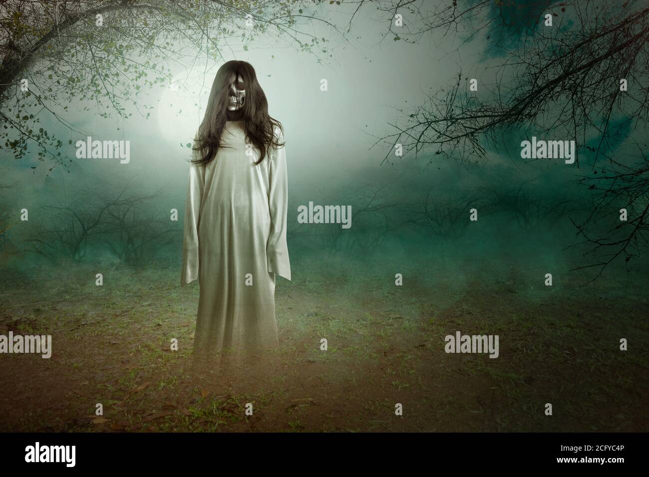 Scary ghost woman standing with haunted forest background. Halloween ...