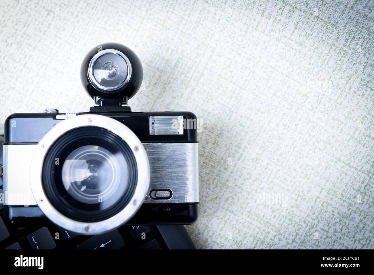 Top view of the camera and computer keyboard on a flat background Stock ...