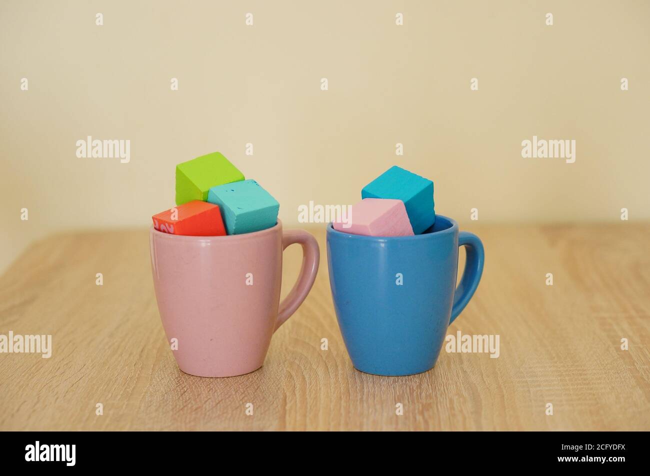 Colorful wooden blocks in cups Stock Photo - Alamy