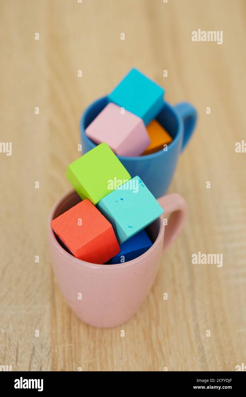 Colorful wooden blocks in cups Stock Photo - Alamy