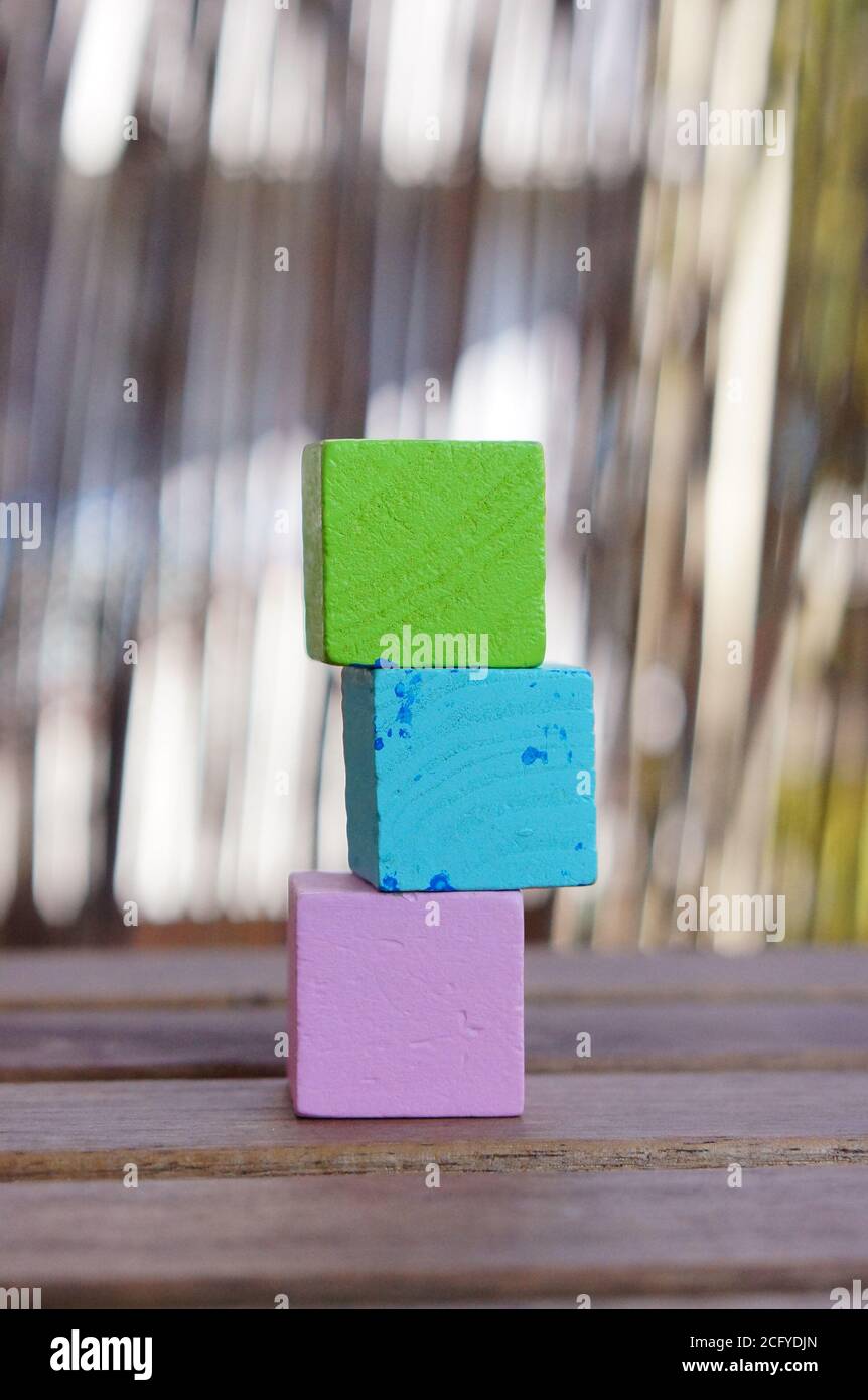 Three wooden blocks stacked hi-res stock photography and images - Alamy