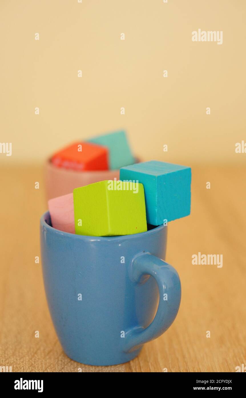 Colorful wooden blocks in cups Stock Photo - Alamy