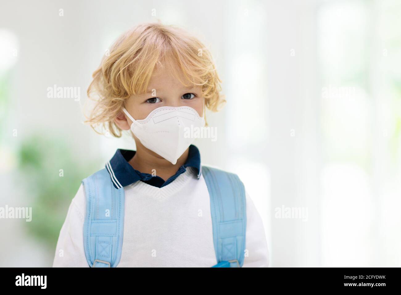 Child wearing face mask during corona virus and flu outbreak. Disease ...