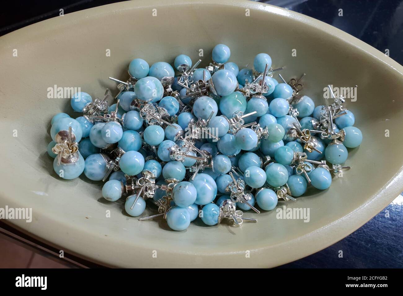 Closeup shot of Larimar beads which is a rare blue variety of the ...
