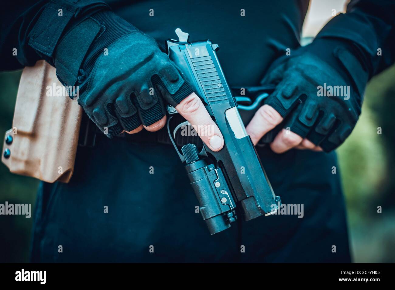 Police man with a revolver hi-res stock photography and images - Alamy