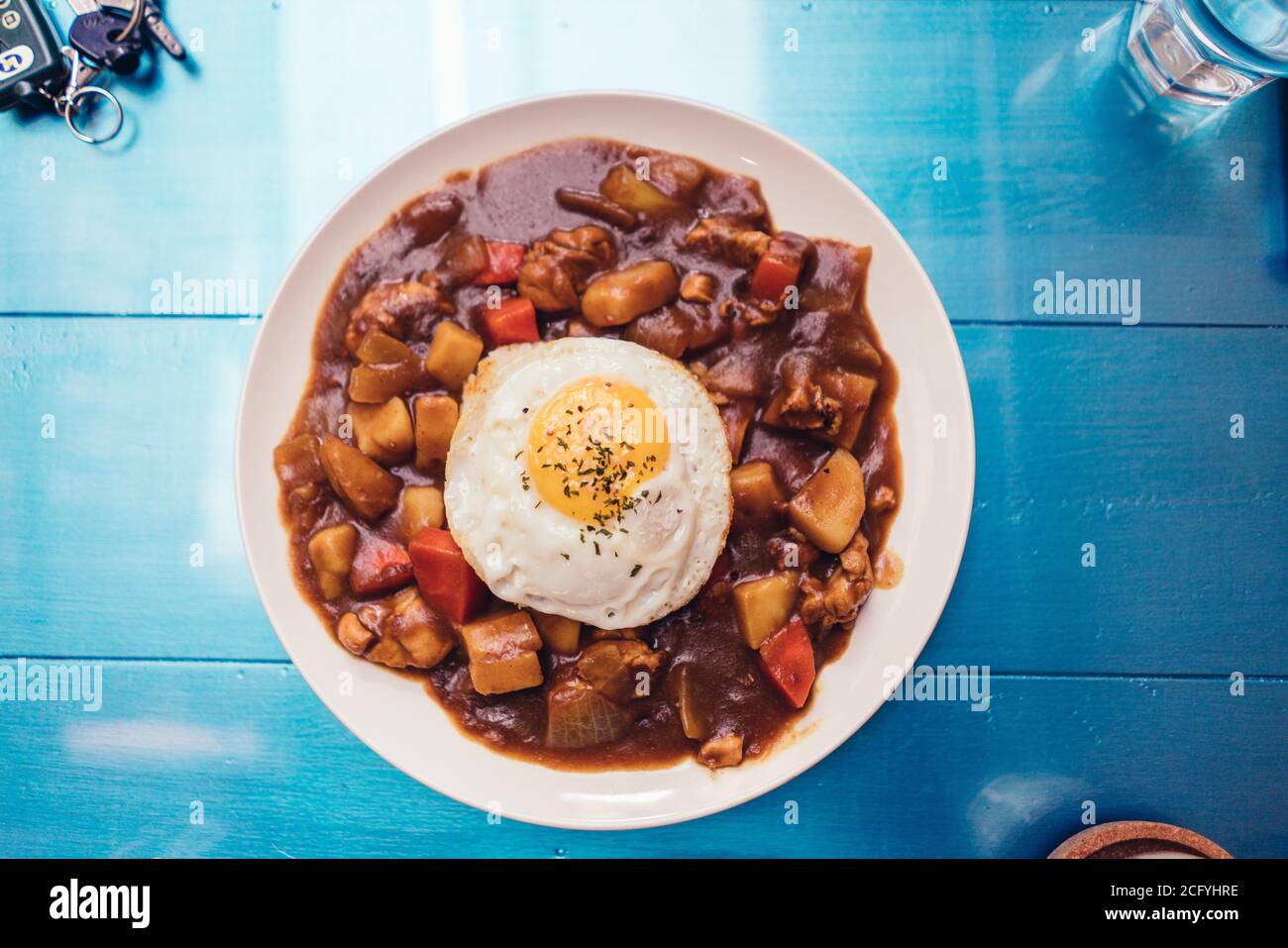 Curry Donburi ( Japanese dish consisting of a bowl of rice topped with ...