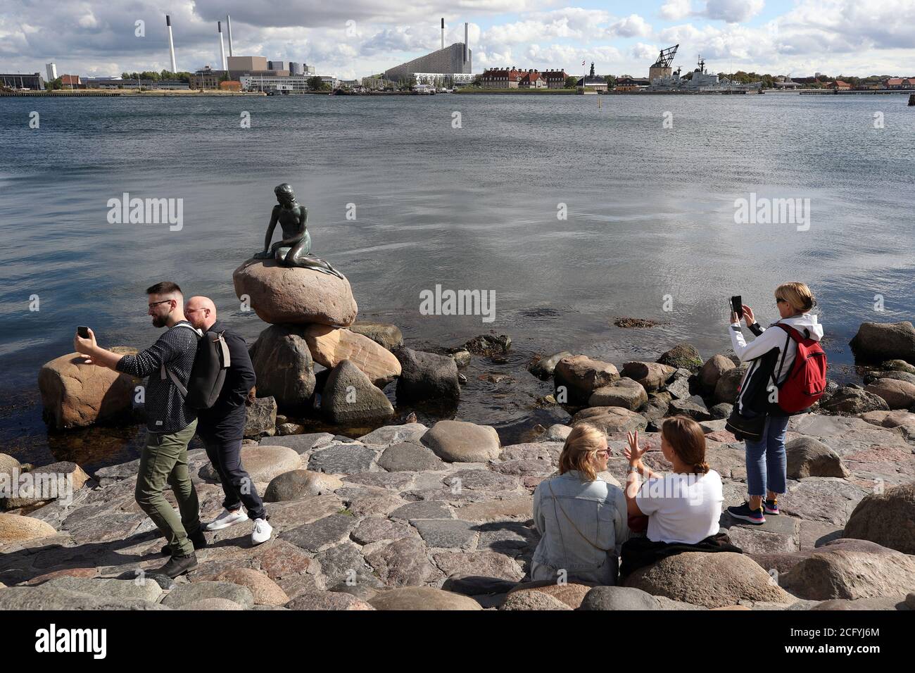 Tourist take photos of the The Little Mermaid bronze statue by Edvard Eriksen, Copenhagen ...