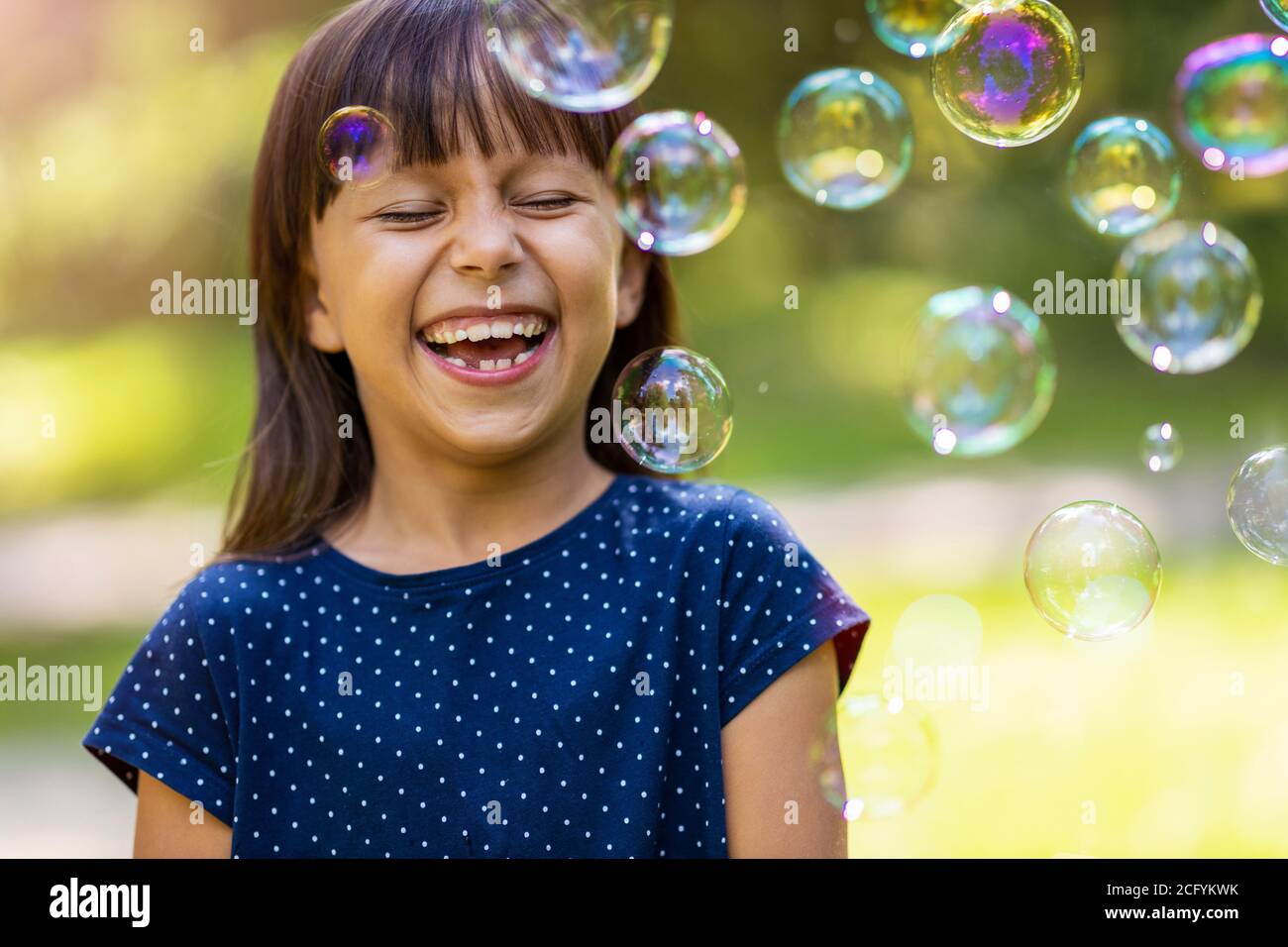 Kids playing bubbles park hi-res stock photography and images - Alamy
