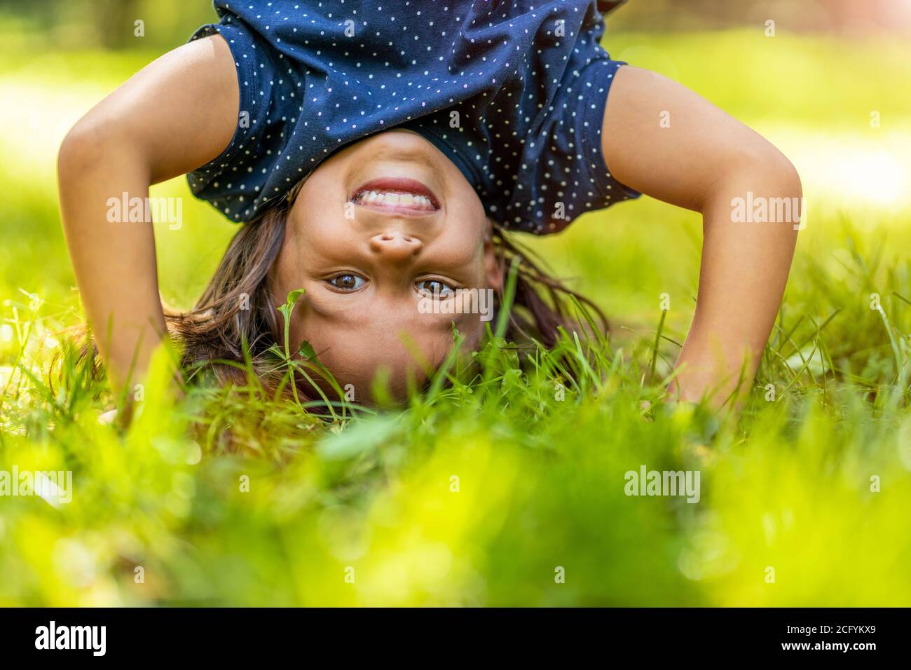 Child headstand hi-res stock photography and images - Alamy