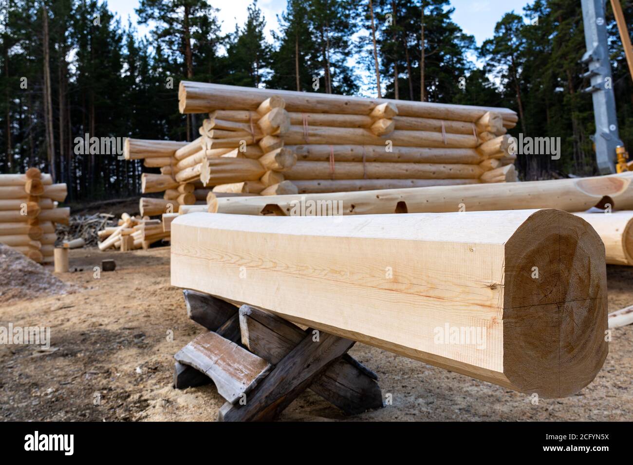 Build a house from logs. Preparation of logs for the assembly of the ...