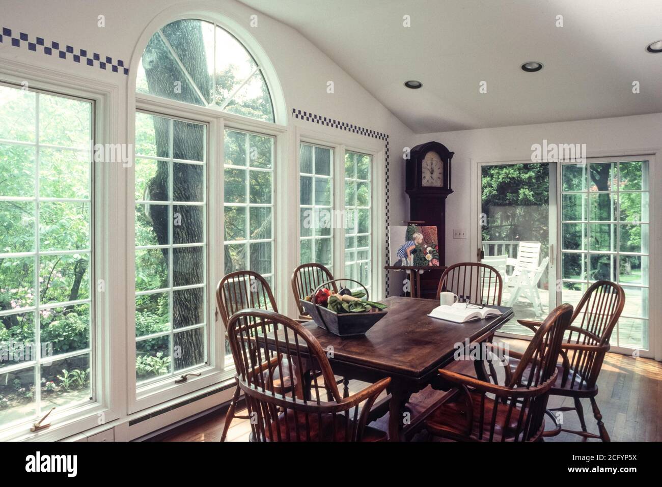 Early American style kitchen and a glass windowed room, USA Stock Photo ...