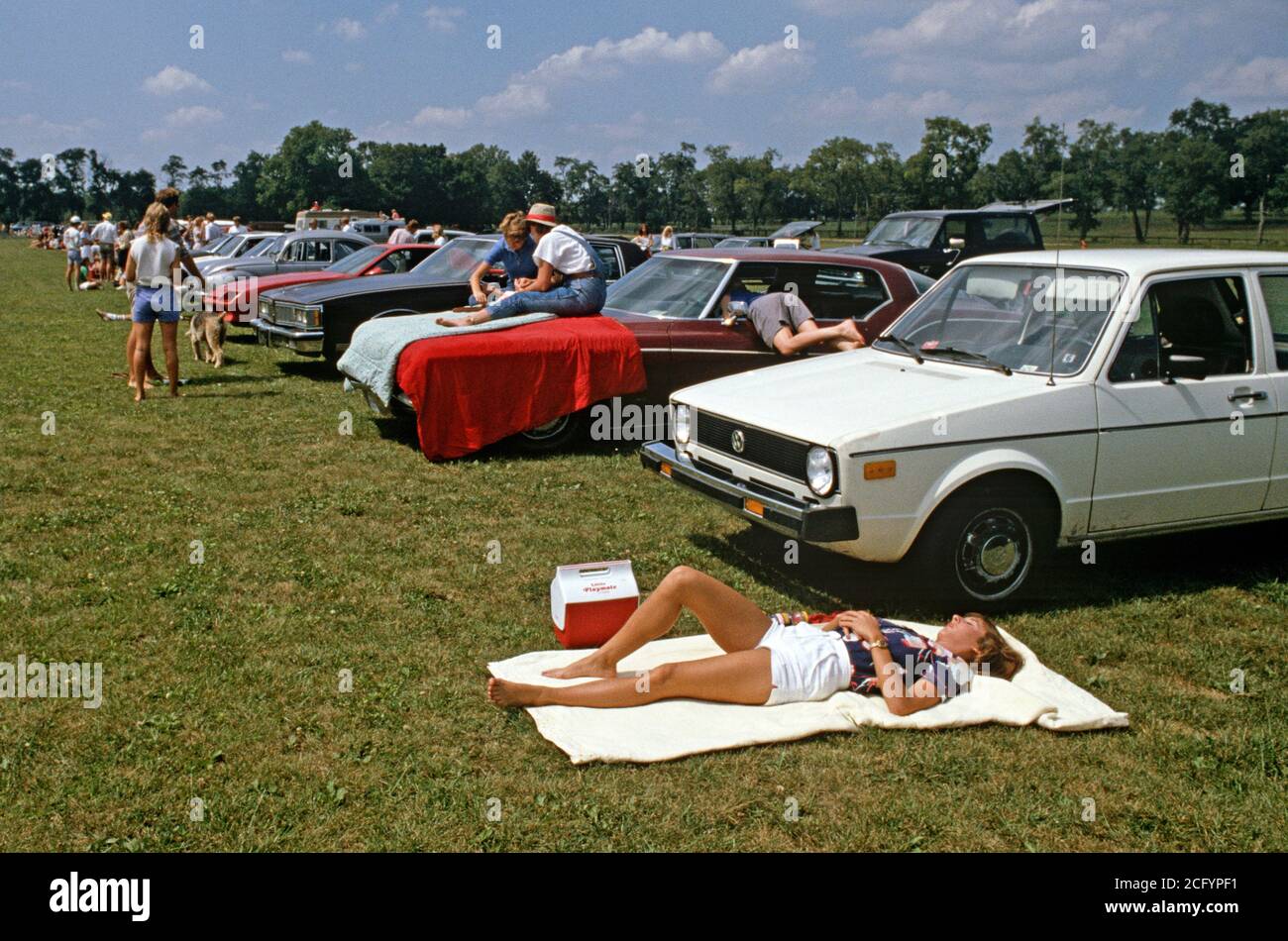 POLO MATCH SPECTATORS SUNBATHING, KENTUCKY, USA, 1980s Stock Photo - Alamy
