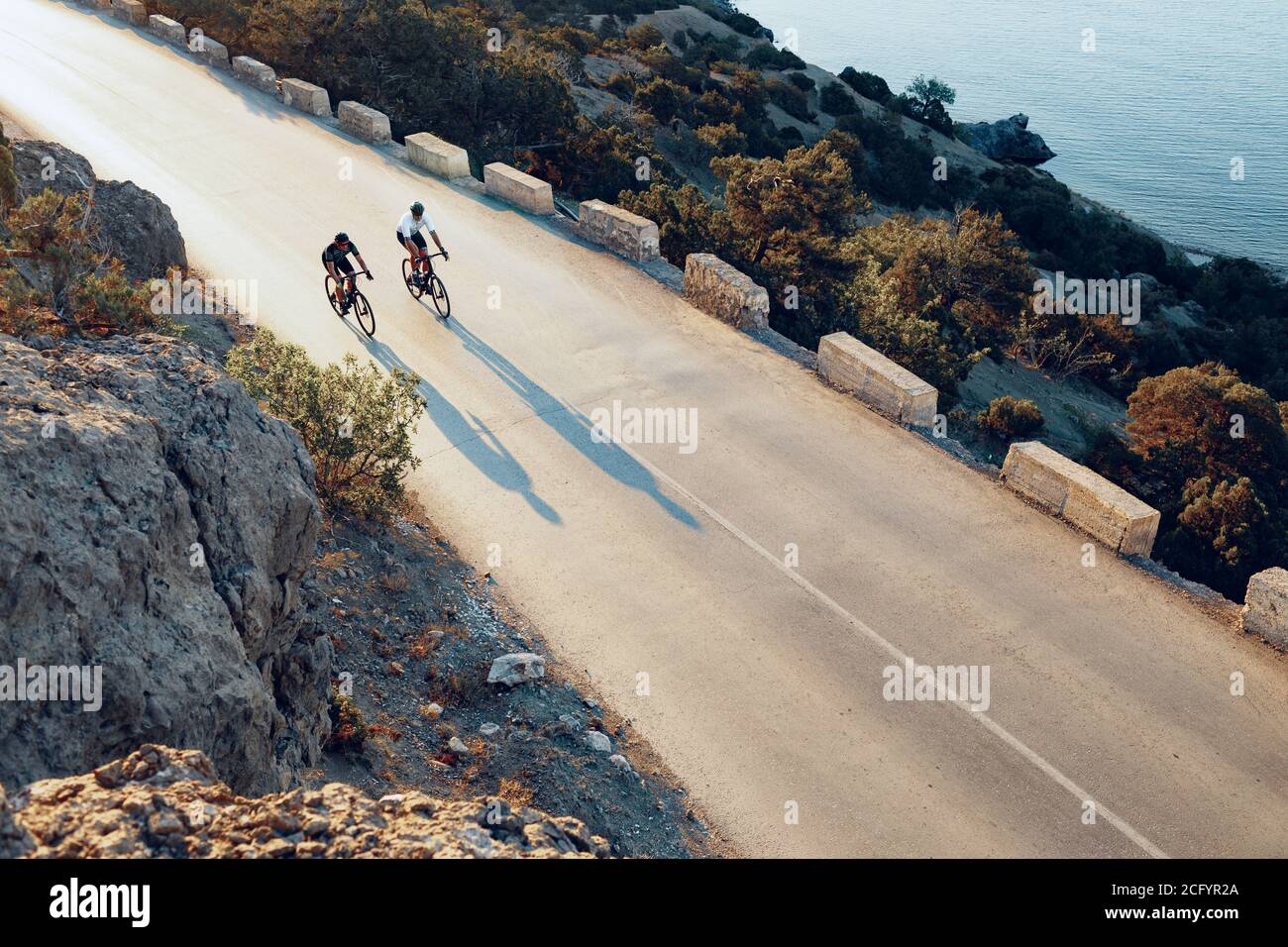 Two professional male cyclists hi-res stock photography and images - Alamy