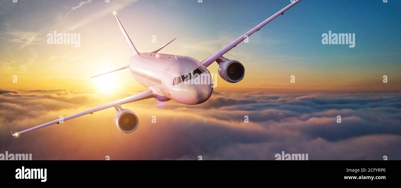 Commercial airplane flying over dramatic sunset sky. Jet plane is the ...