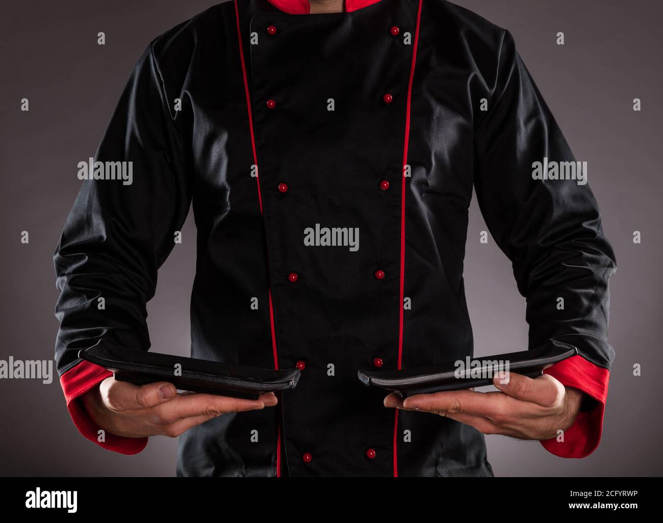 Man holding two plates of food hi-res stock photography and images - Alamy