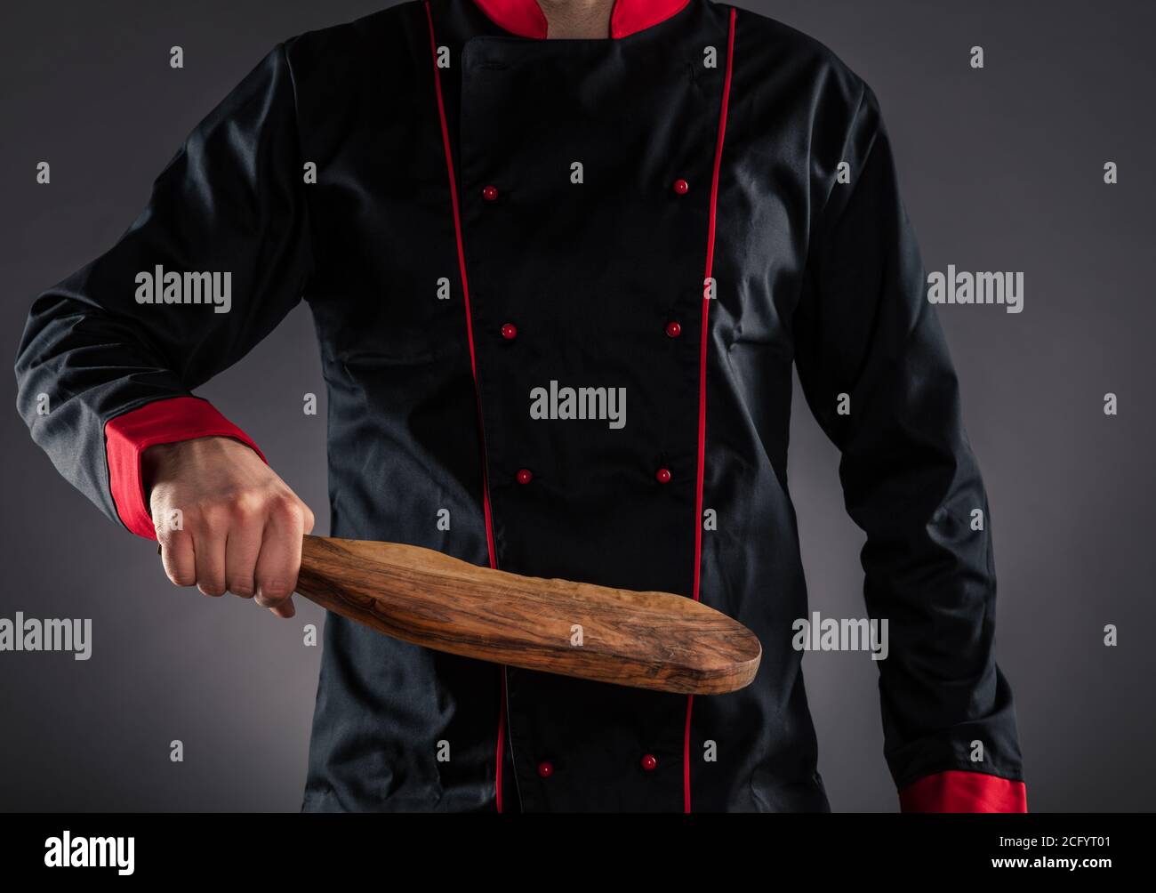 Closeup of master chef holding wooden cutting board. Concept of food ...