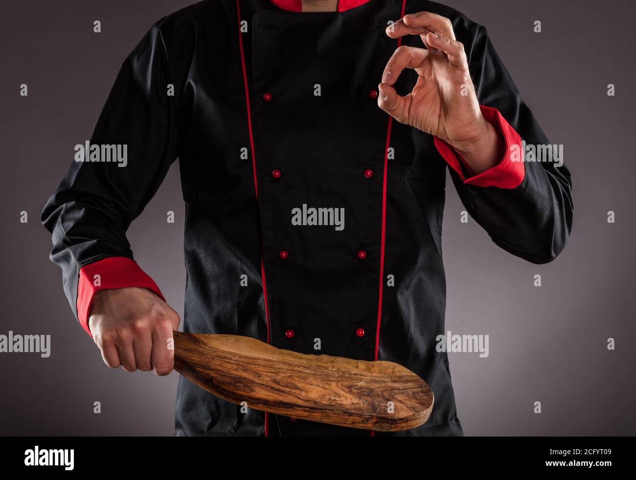 Closeup of master chef holding wooden cutting board. Concept of food ...