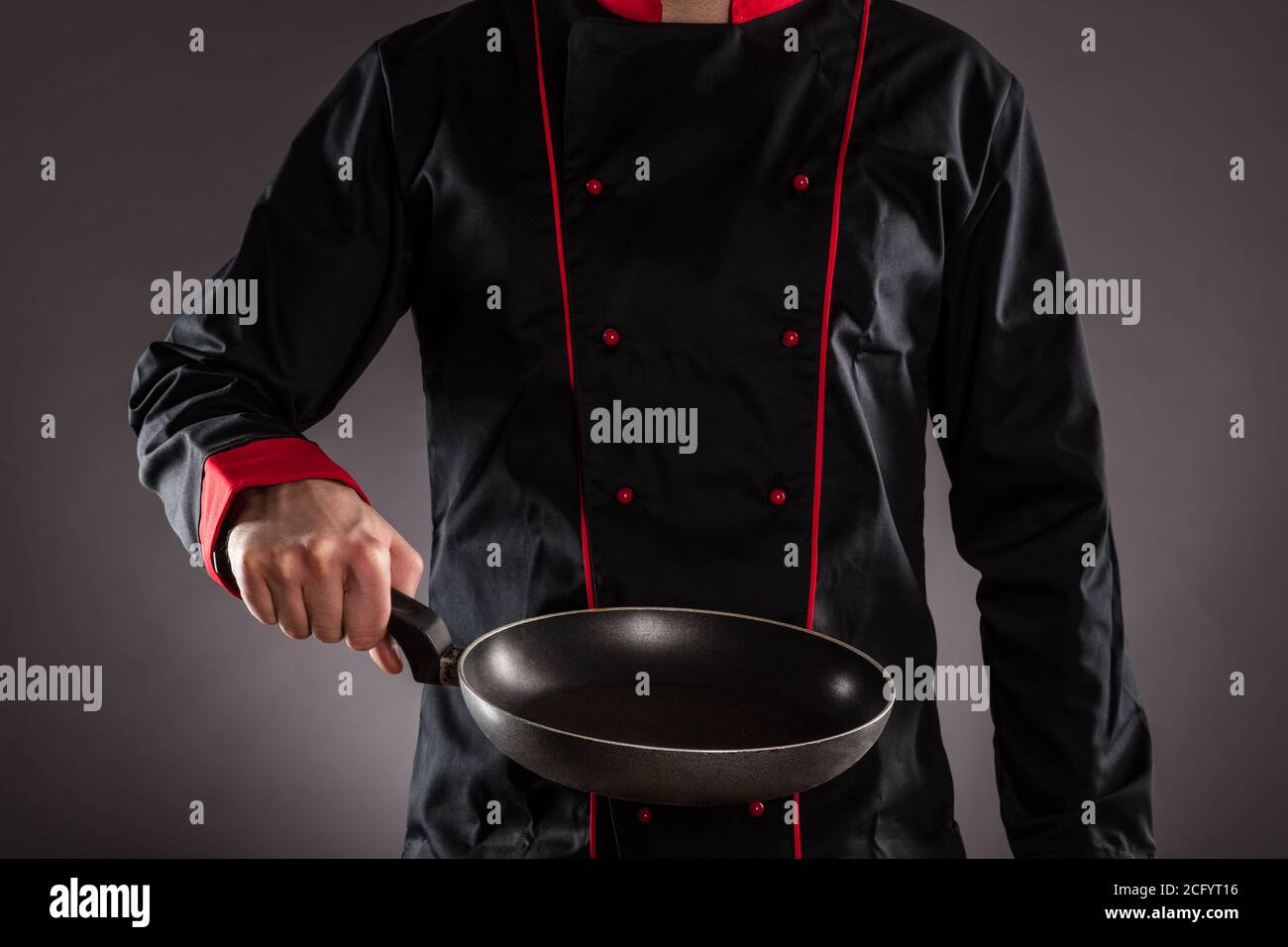 Closeup of master chef holding empty frying pan. Concept of food ...