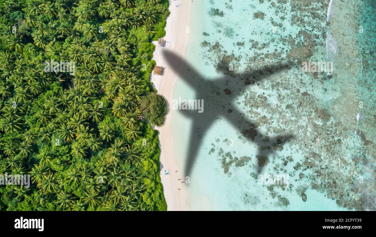 Concept of airplane travel to exotic destination with shadow of ...