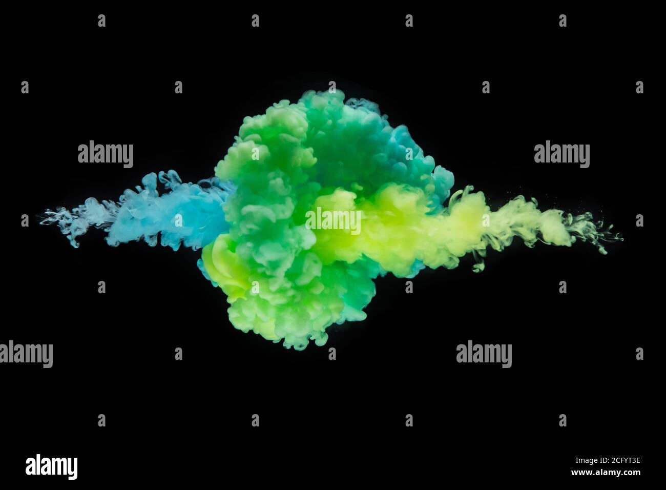 Coloured acrylic ink mixing in water isolated on black background ...