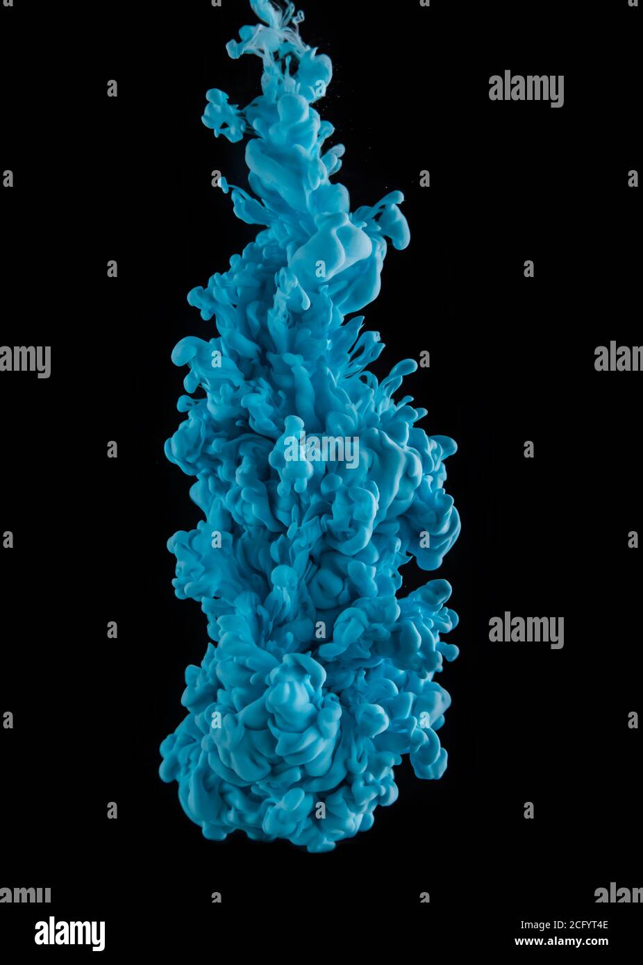 Coloured acrylic ink mixing in water isolated on black background ...