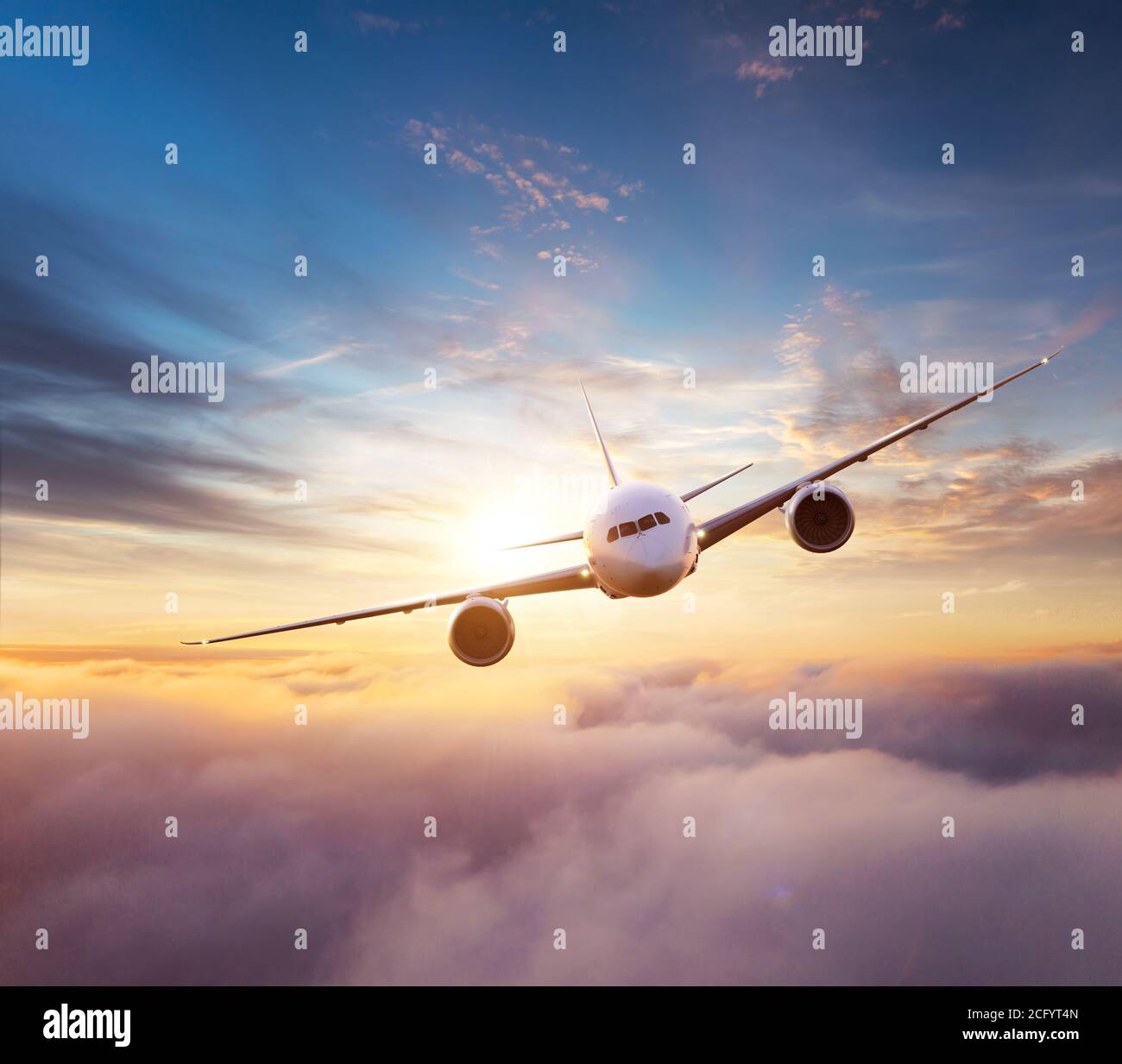 Commercial airplane flying over dramatic sunset sky. Jet plane is the ...