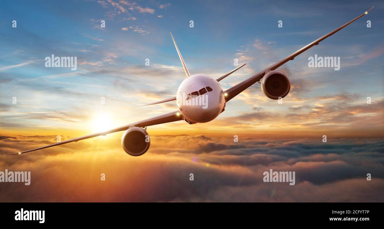 Commercial airplane flying over dramatic sunset sky. Jet plane is the ...