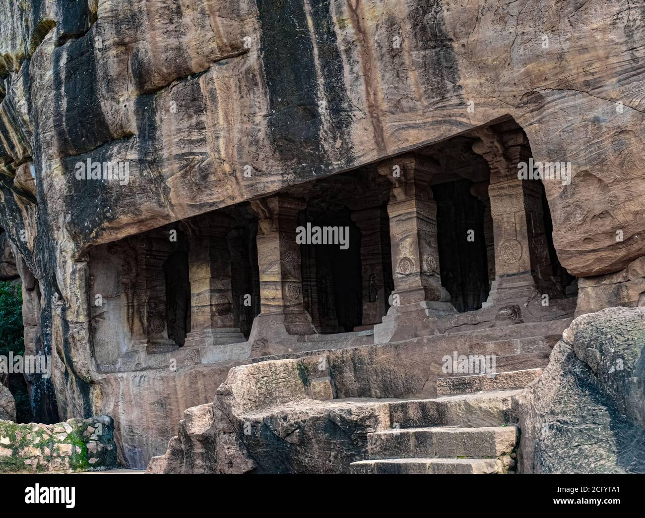 Ancient stone pillars carving inside a single red sandstone Rocky ...