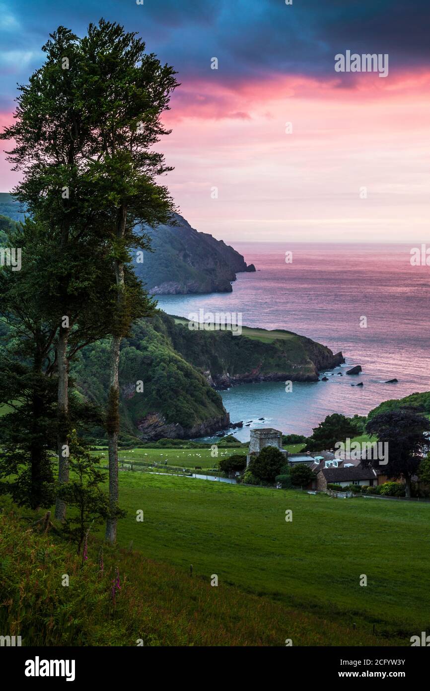 A summer sunset over Lee Bay near Lynton and Lynmouth, north Devon ...