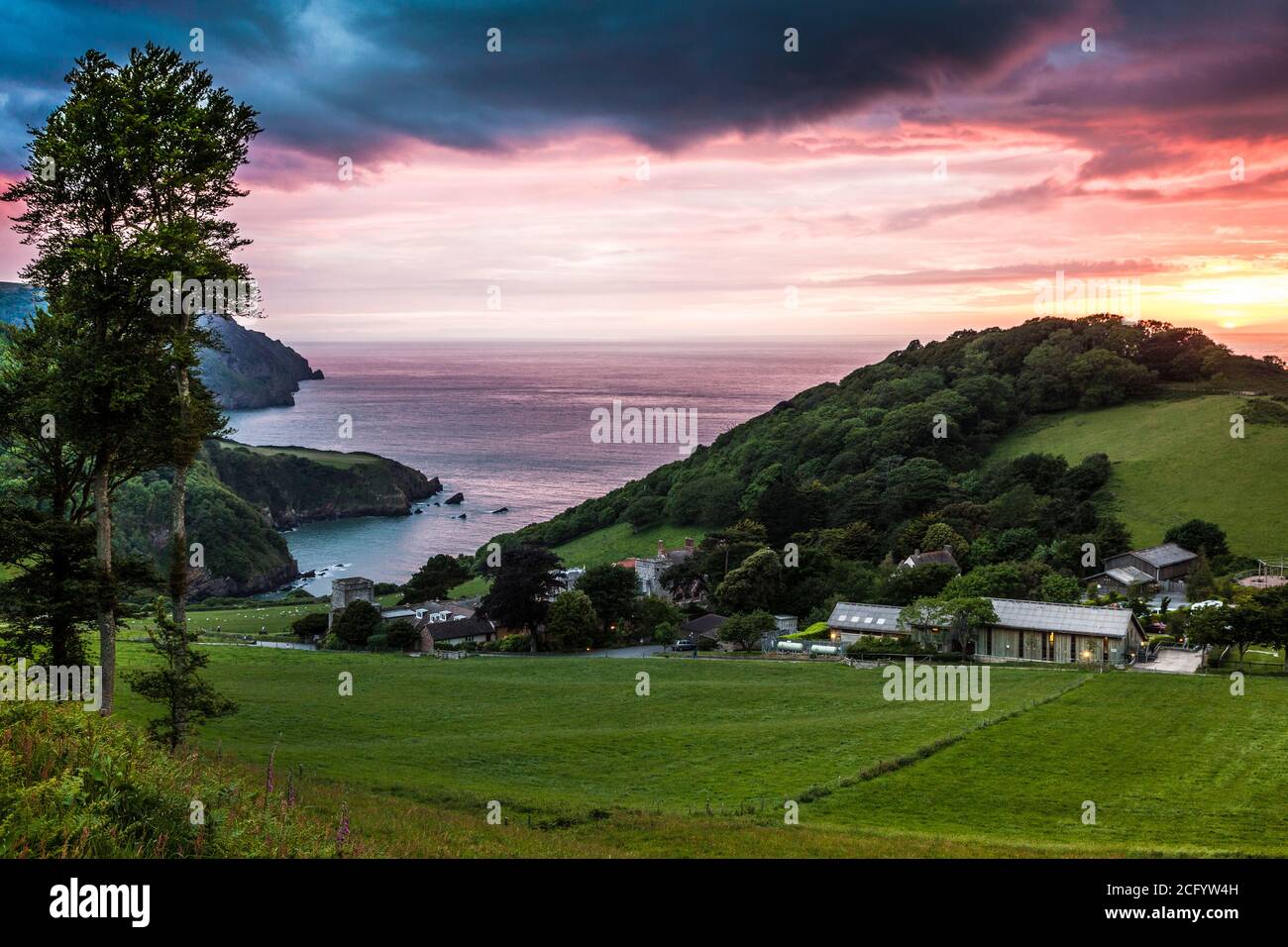 A summer sunset over Lee Bay near Lynton and Lynmouth, north Devon ...